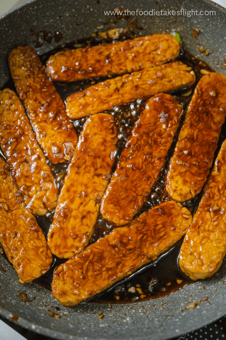 Sweet and Spicy Tempeh with Garlic Curry Noodles - The Foodie Takes Flight